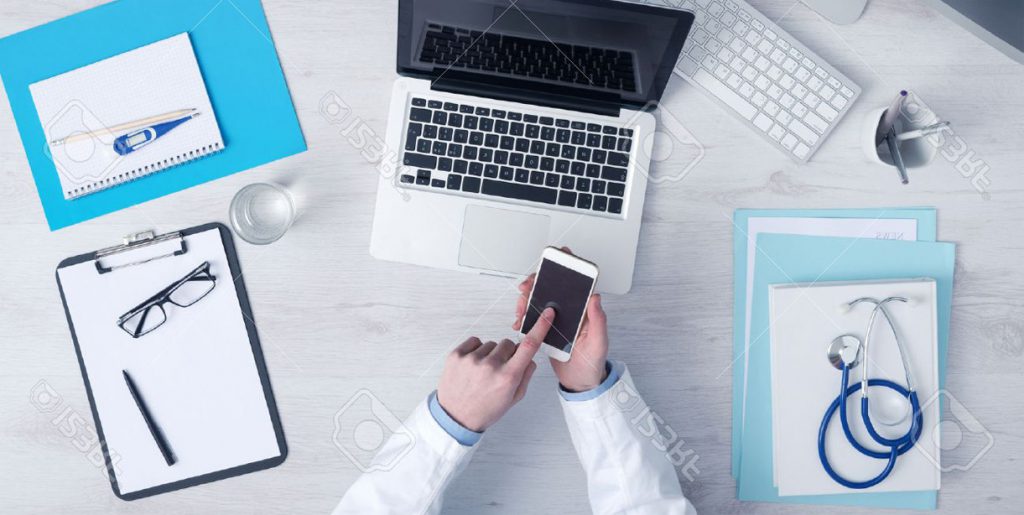 39447102-doctor-working-at-office-desk-and-using-a-mobile-touch-screen ...